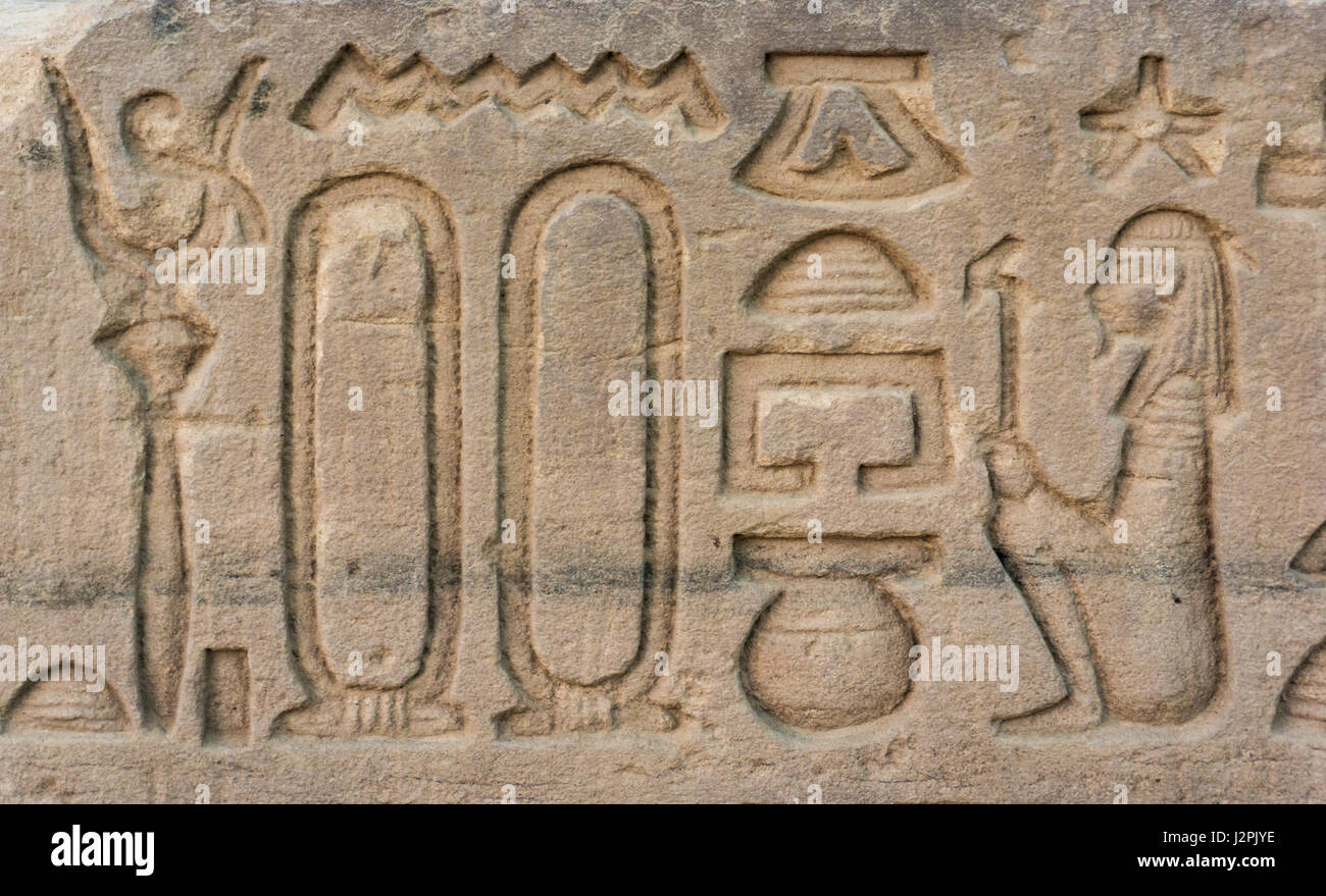 old egypt hieroglyphs carved on the stone. Detail from temple wall in ...
