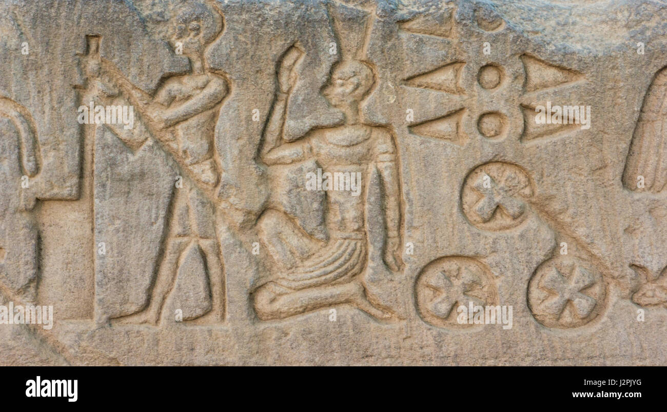 old egypt hieroglyphs carved on the stone. Detail from temple wall in ...