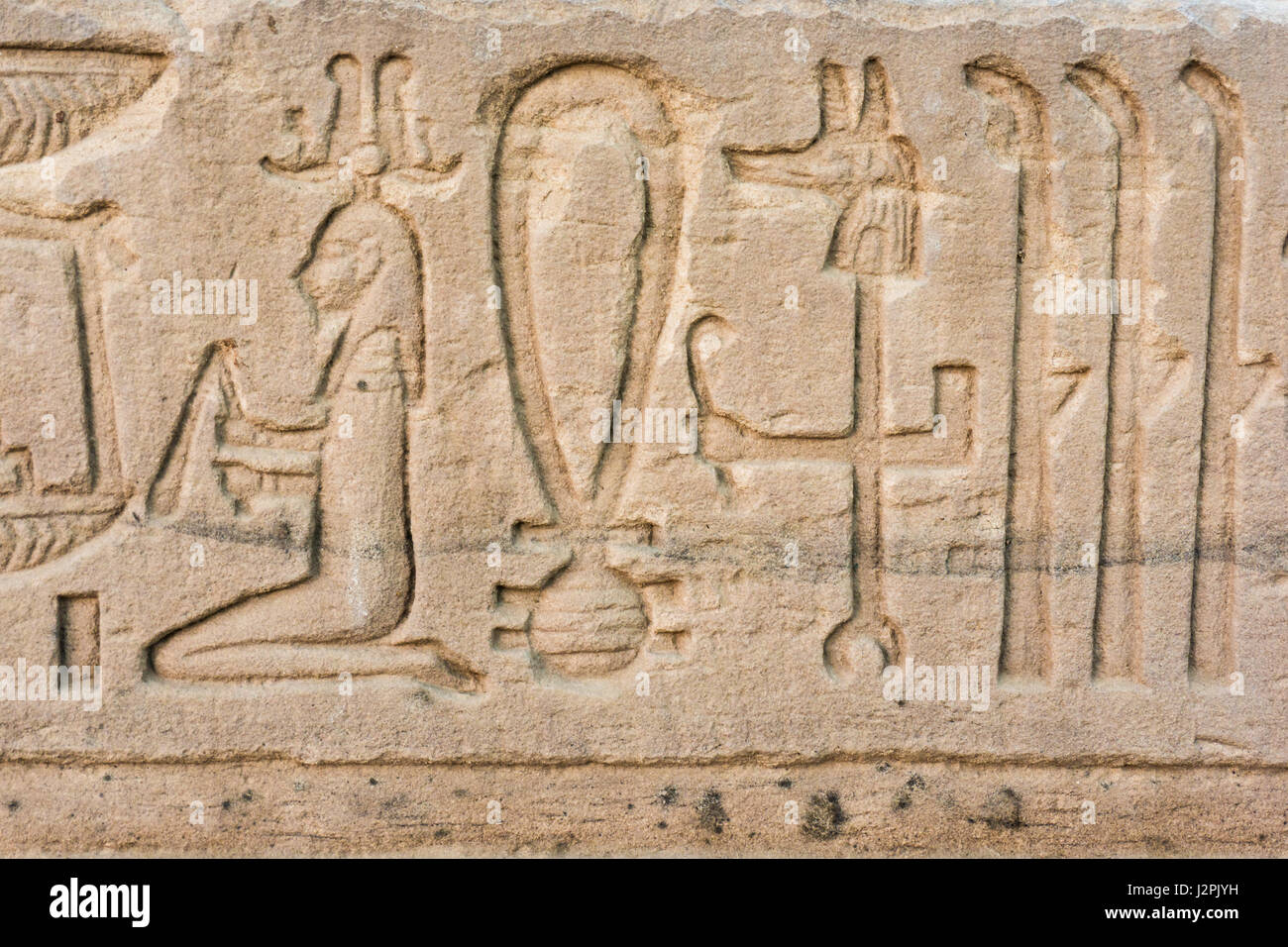 old egypt hieroglyphs carved on the stone. Detail from temple wall in ...