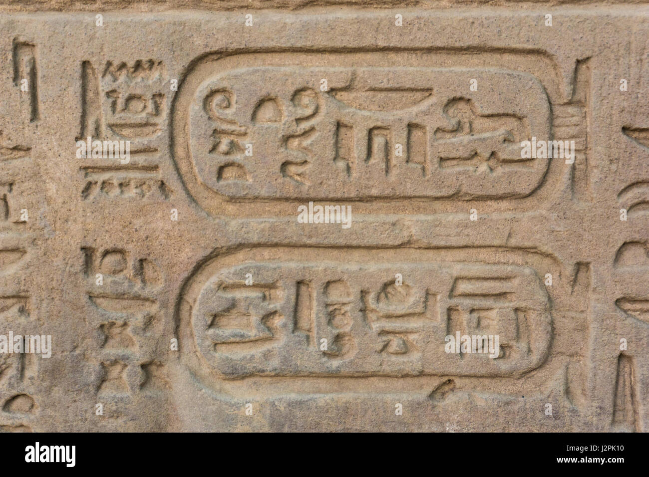 old egypt hieroglyphs carved on the stone. Detail from temple wall in ...