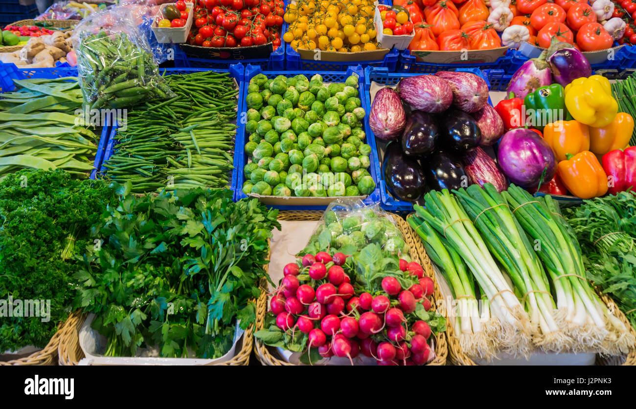 market with various colorful fresh fruits and vegetables. Farmers ...