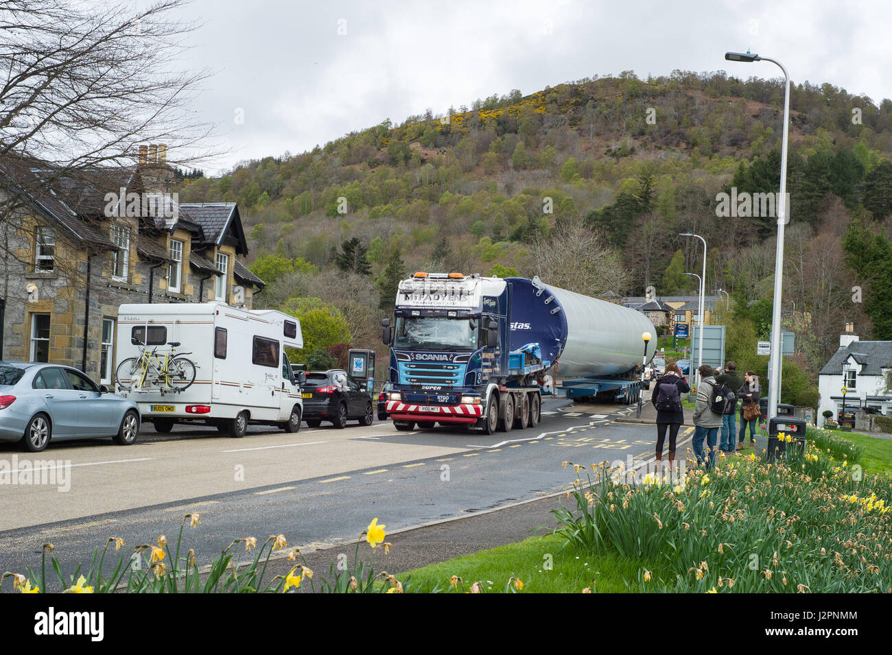 Huge wind turbine tower being transported along the A82 passing through ...
