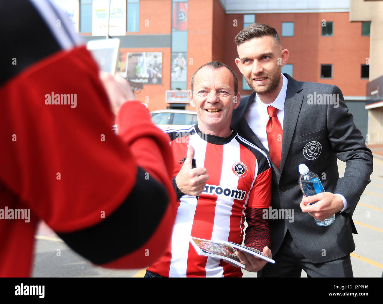 Sheffield United's Jay O'Shea poses for a photograph with a fan before ...