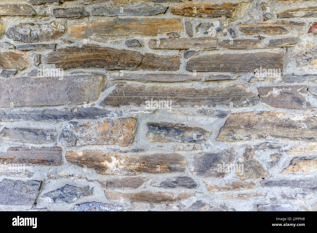 Uneven medieval stone wall for texture or background Stock Photo - Alamy