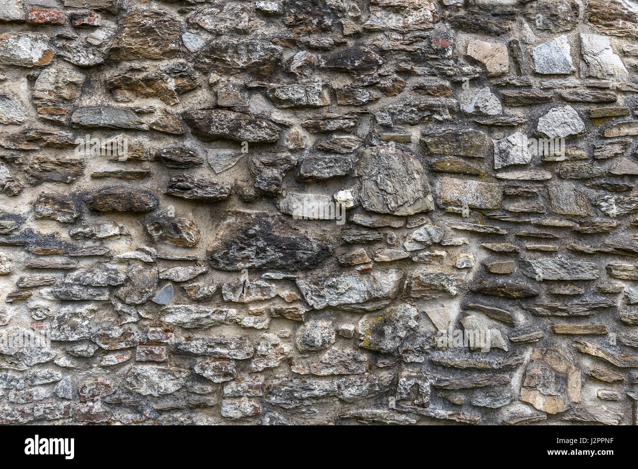 Rock wall background, part of a medieval wall Stock Photo - Alamy