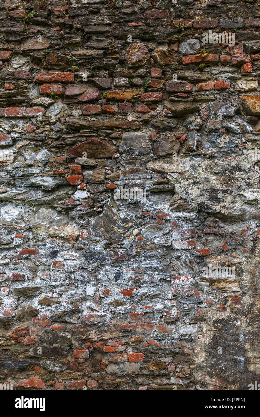 Old worn brick and stone wall texture background Stock Photo - Alamy