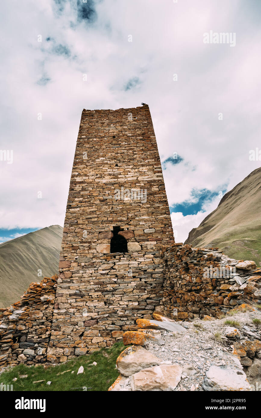 Old Stone Watchtower Of Ancient Fortress On Mountain Background Near ...