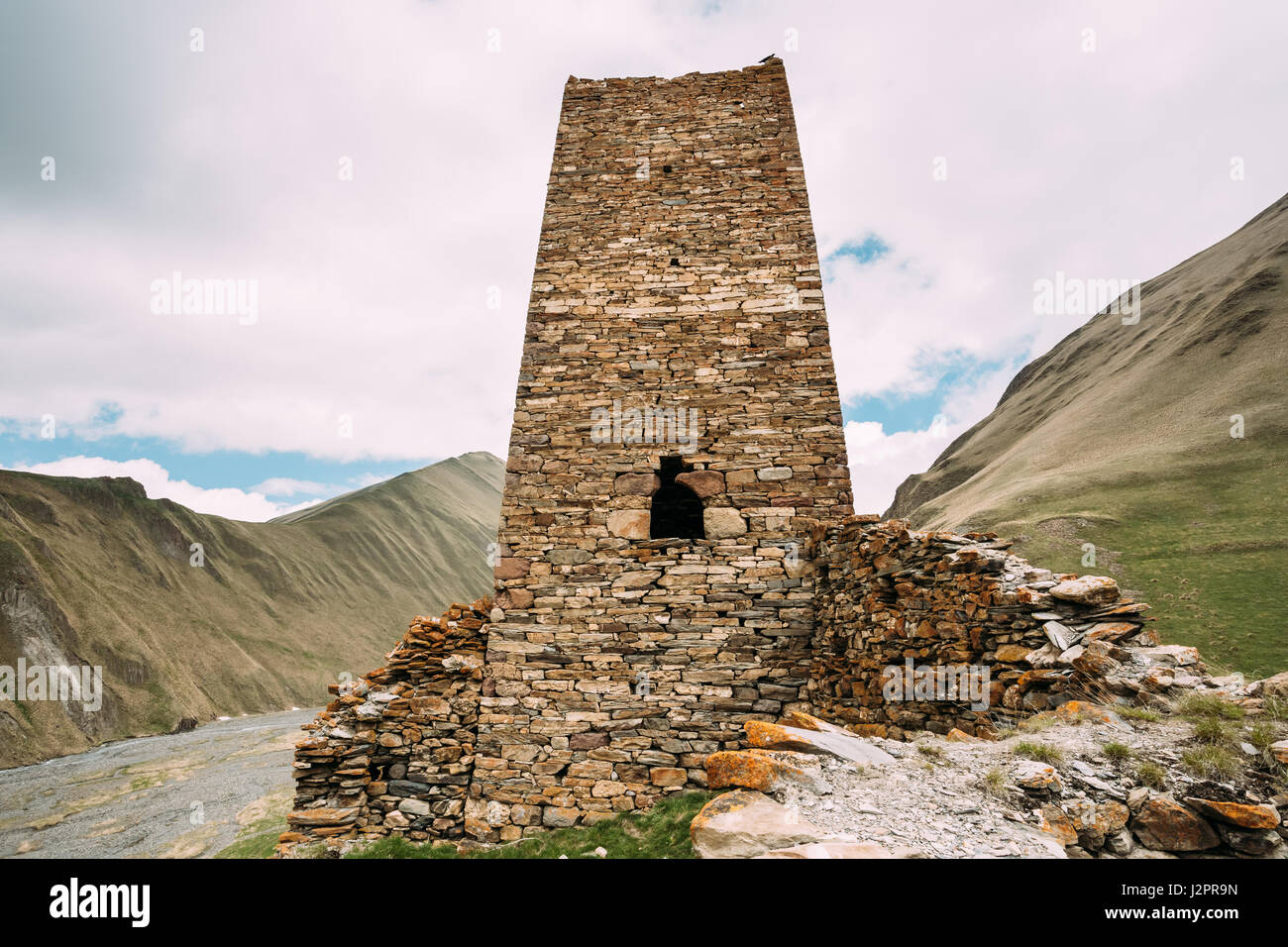 Old Stone Watchtower Of Ancient Fortress On Mountain Background Near ...