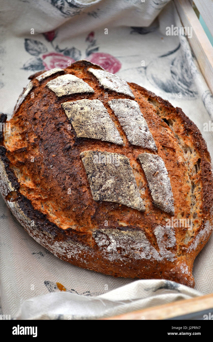A loaf of artisanal bread in a rustic traditional bakery Stock Photo ...