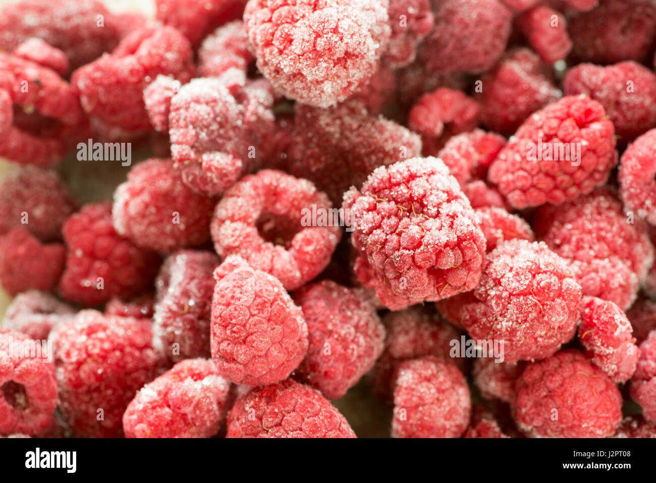 closeup to group of frozen raspberries Stock Photo - Alamy