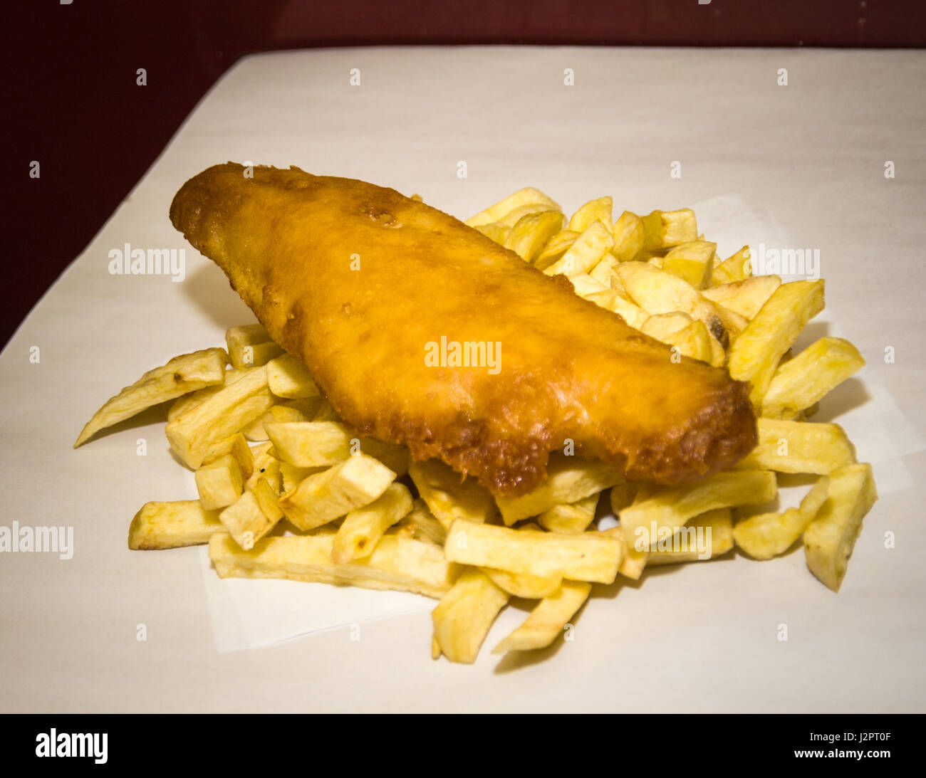 Fish and chips on wrapping paper in a fish and chip shop Stock Photo ...