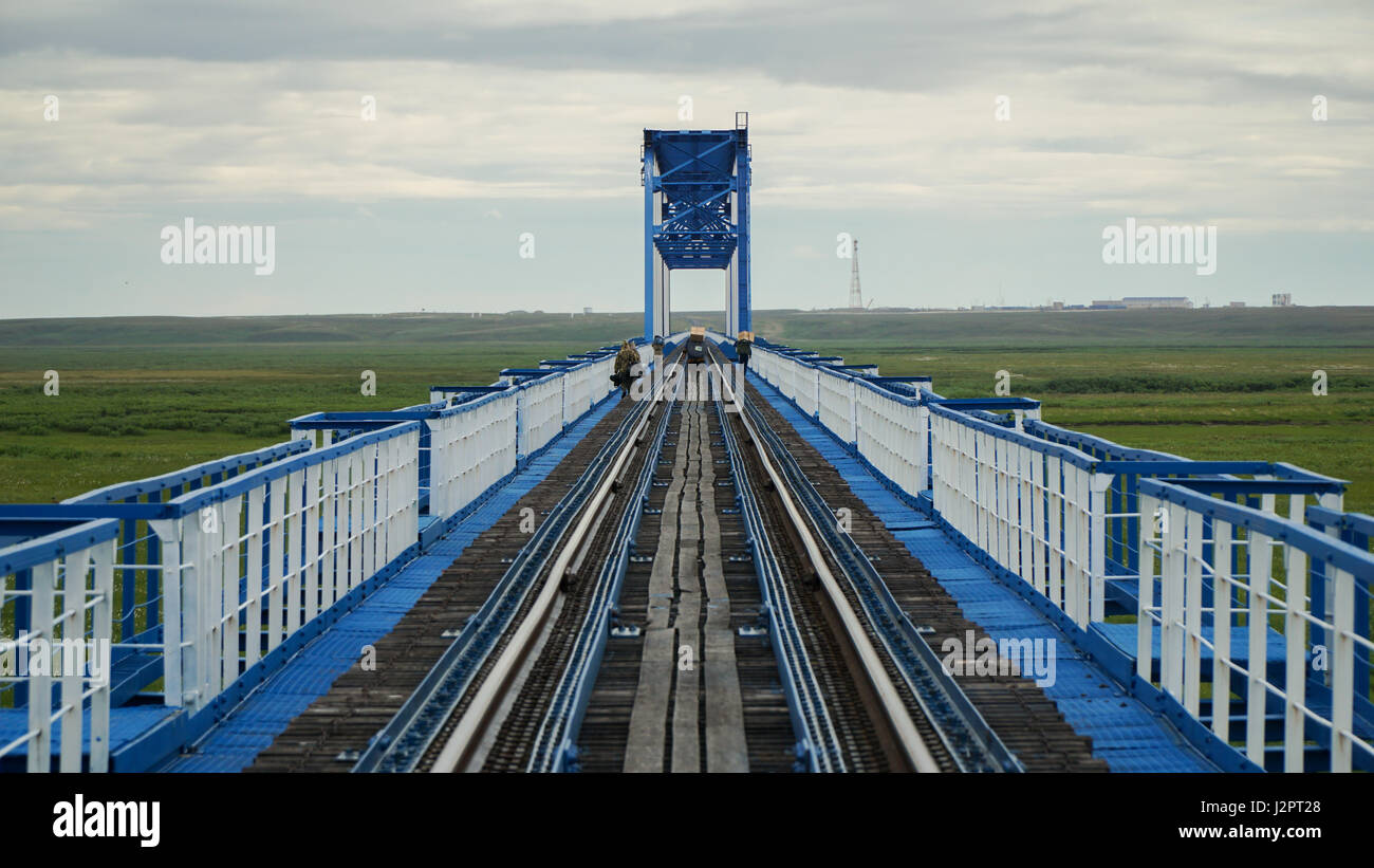 Railway bridge across the Yuribey river on the Yamal Peninsula with a ...