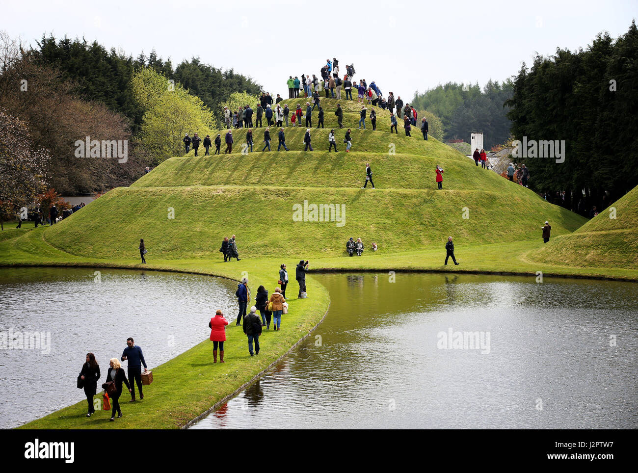 Visitors climb the Snail Mound in the Garden of Cosmic Speculation in ...