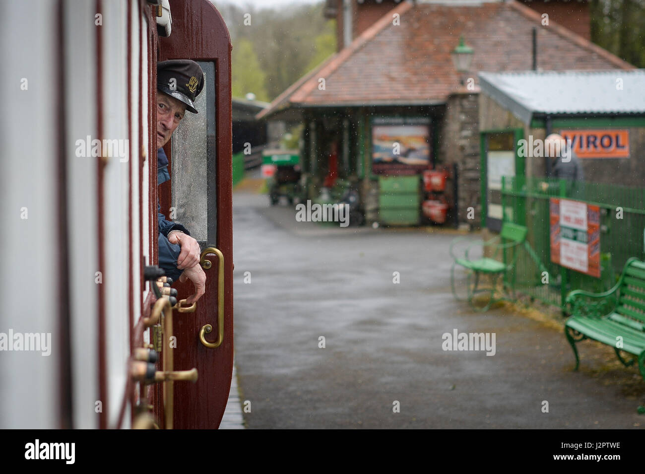Guard Jim Price checks the platform, aboard a narrow gauge steam train ...