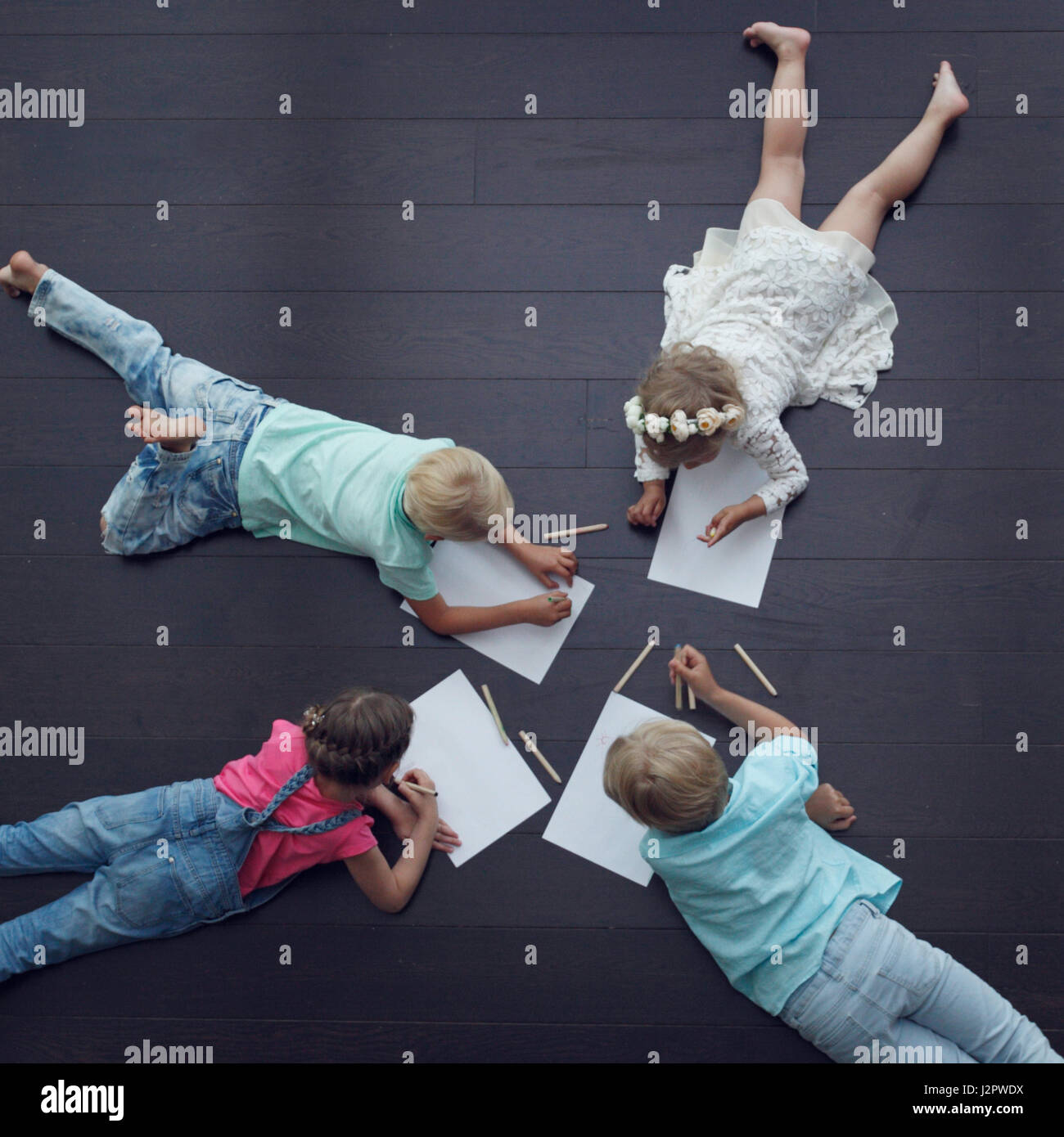 Group of cute children drawing with colorful pencils on floor Stock ...