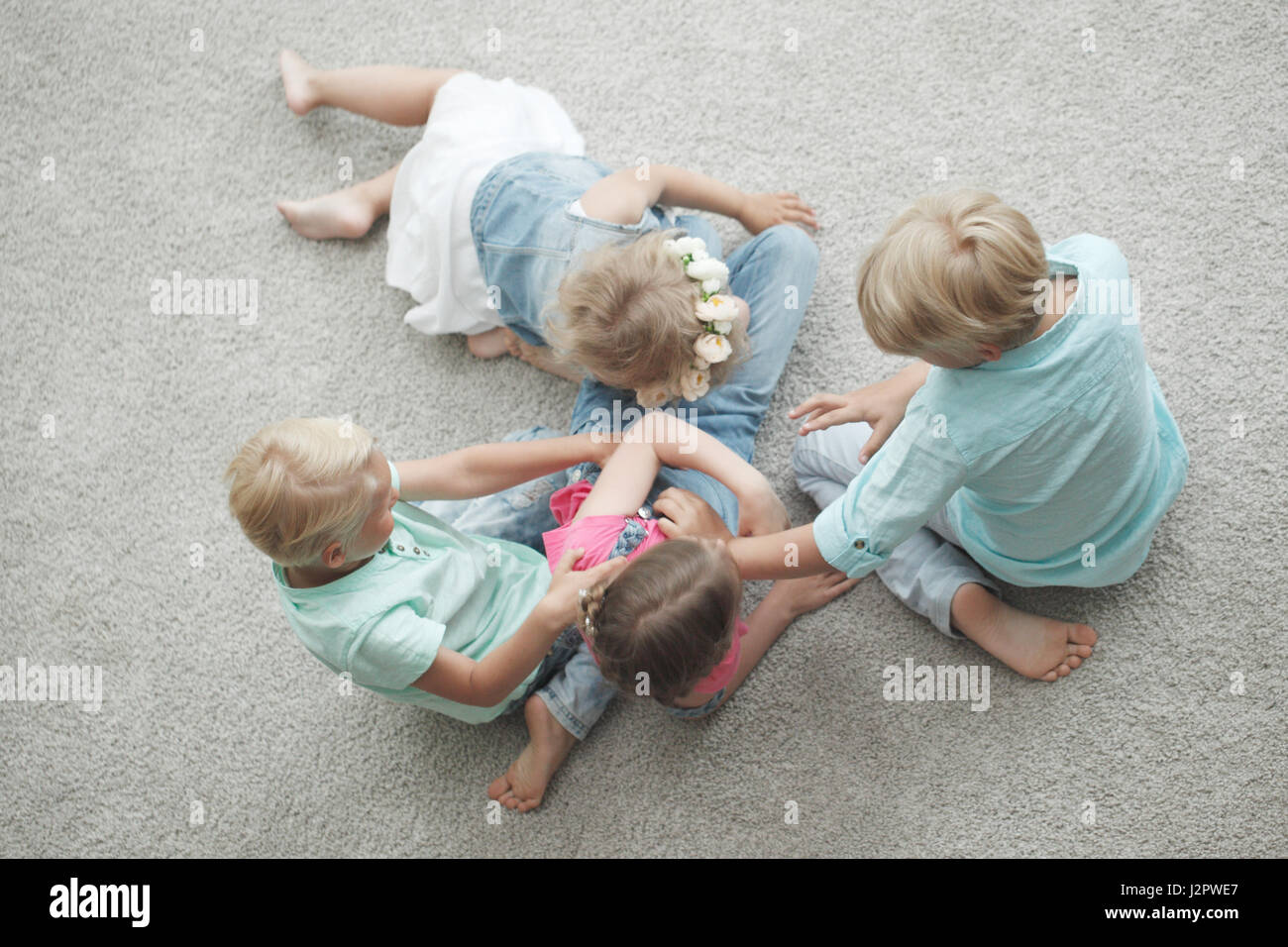 Kids playingon the floor, top view Stock Photo - Alamy