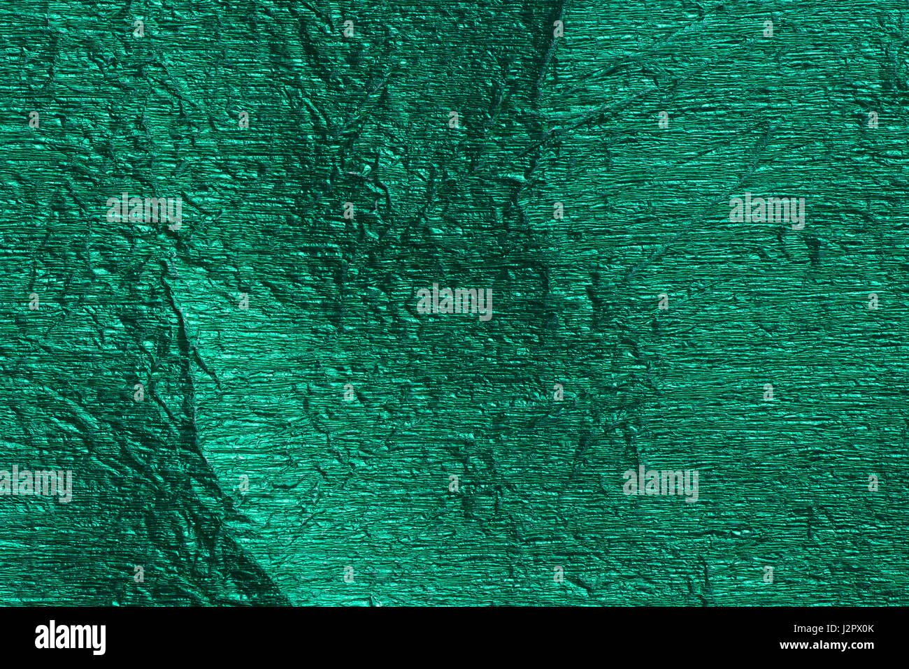 green color creased metallic foil background texture Stock Photo - Alamy
