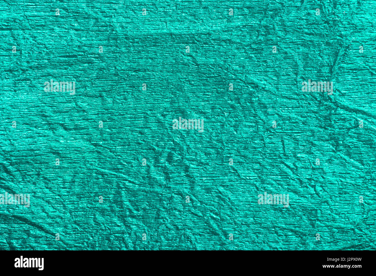 green color creased metallic foil background texture Stock Photo - Alamy