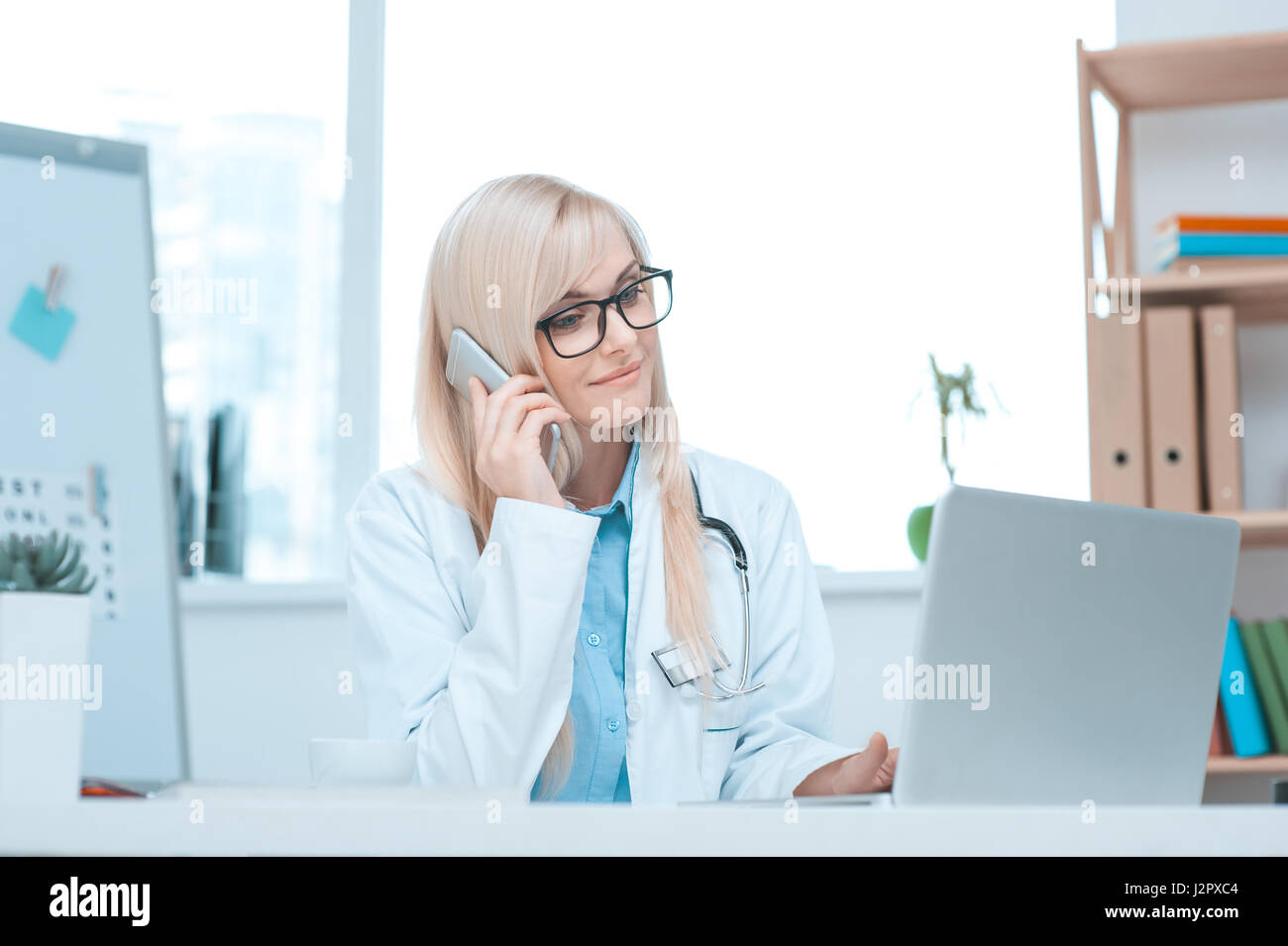 Young woman doctor occupation in the hospital office Stock Photo - Alamy
