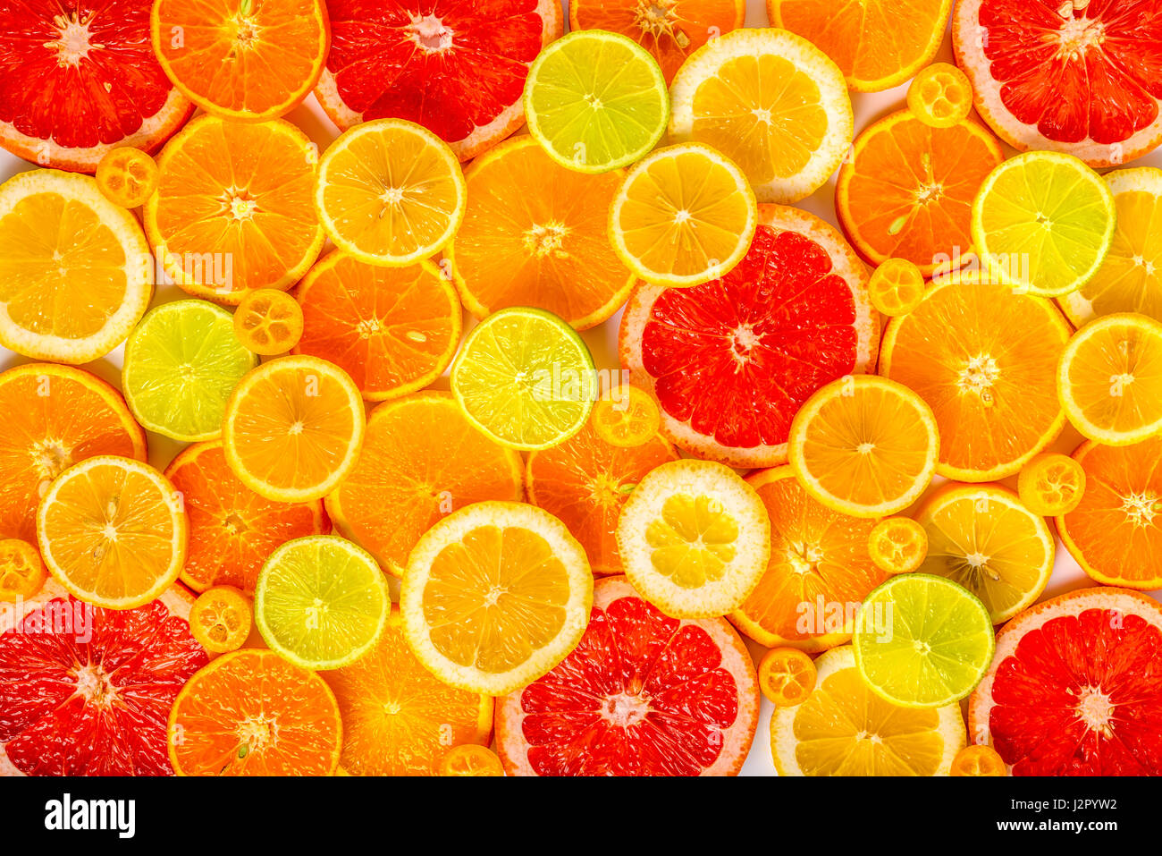 beautiful fresh sliced mixed citrus fruits like background, concept of ...