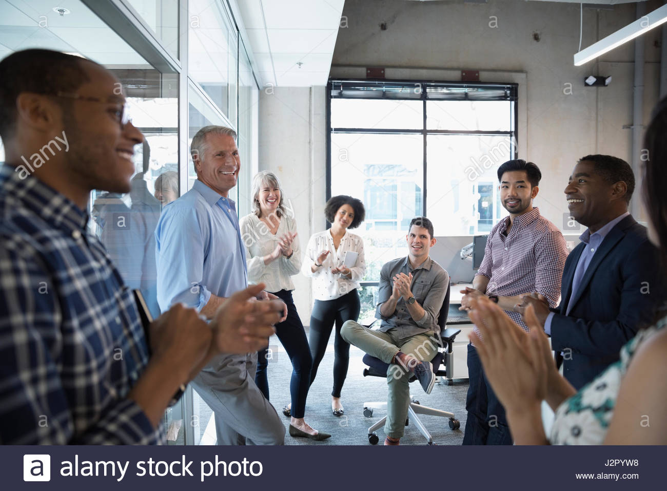 Smiling business people clapping in office meeting Stock Photo - Alamy