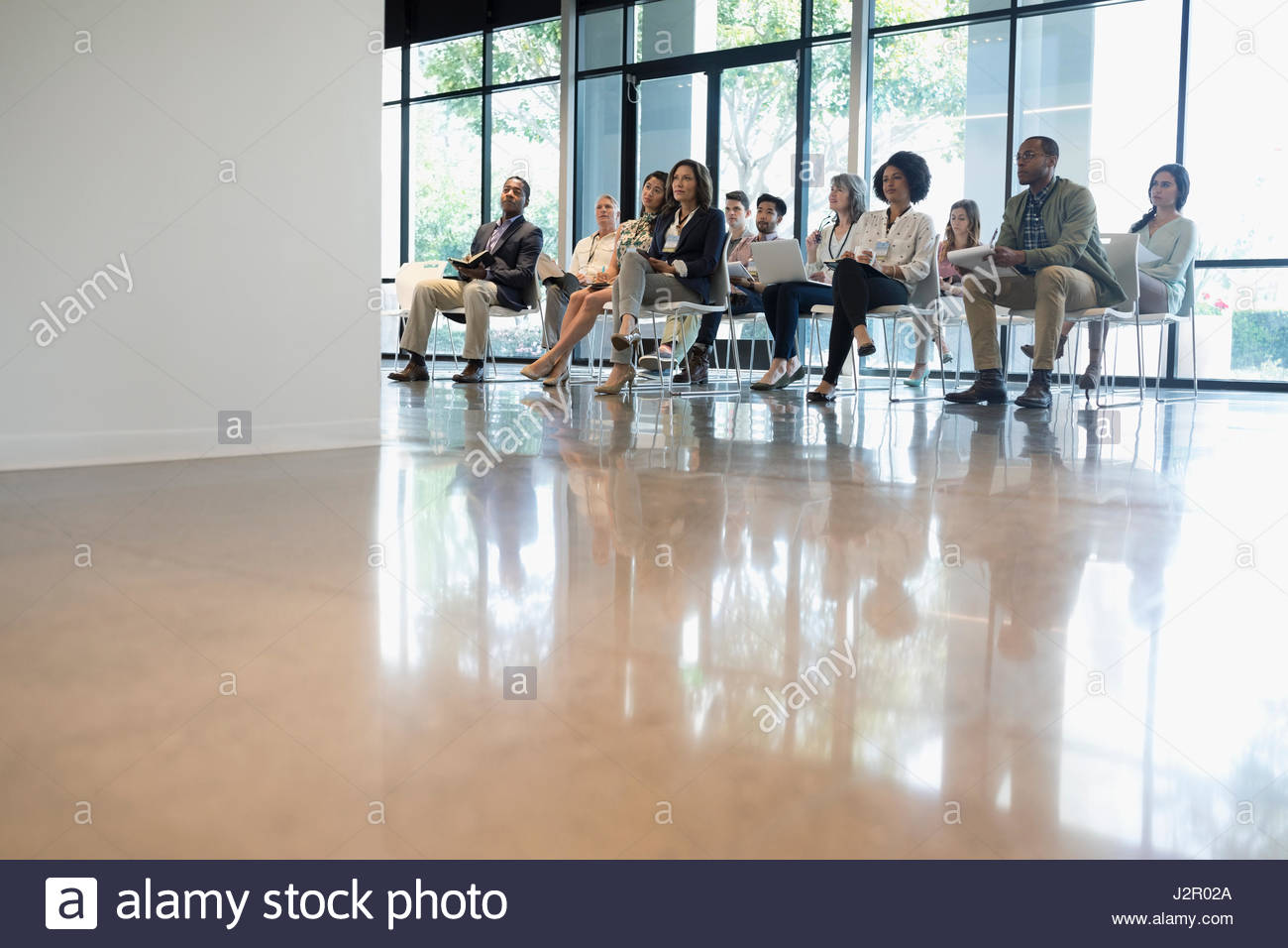 Attentive conference audience listening to presentation in office Stock ...