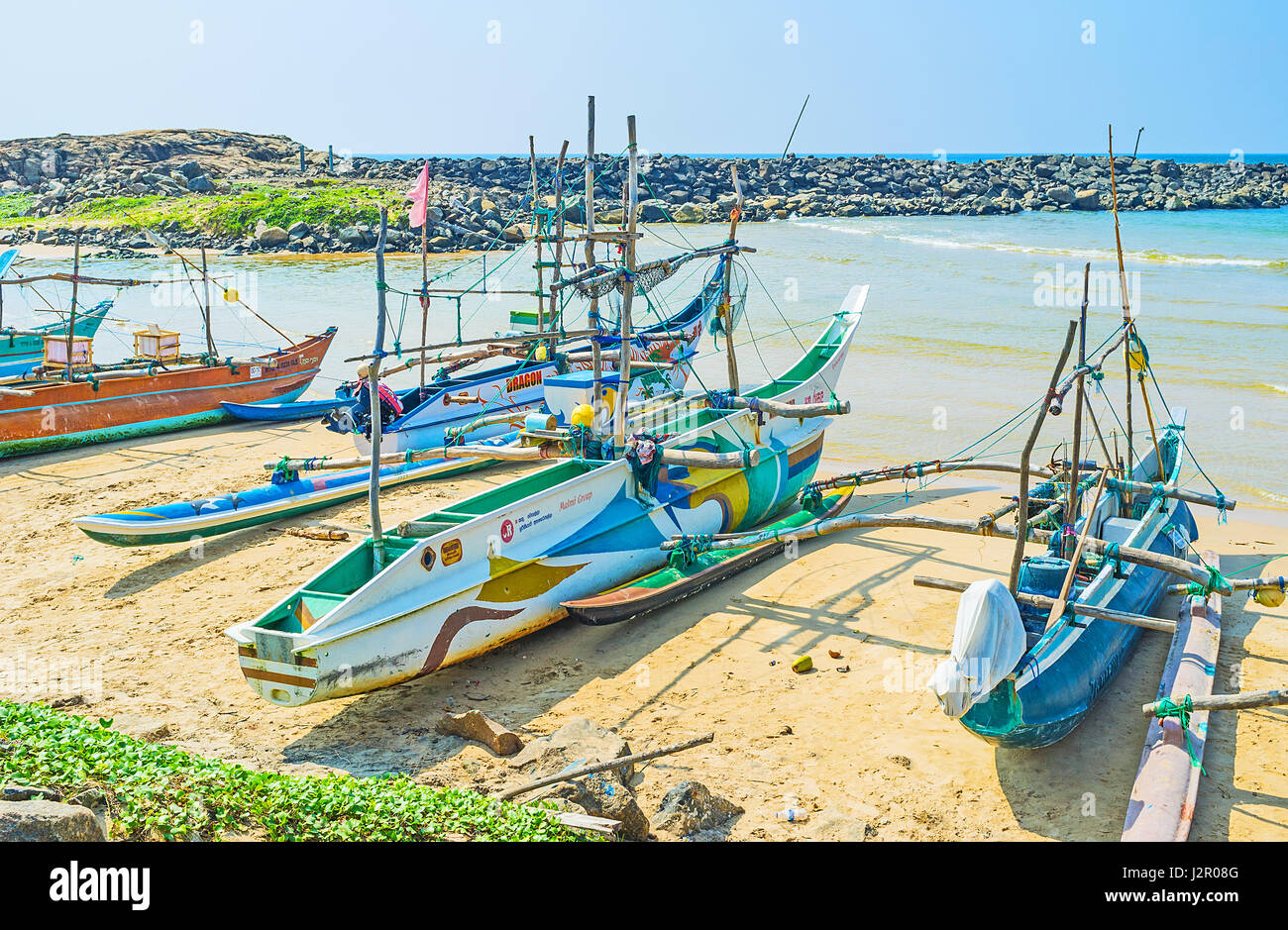 HIKKADUWA, SRI LANKA - DECEMBER 4, 2016: The colorful oruwa canoes on ...