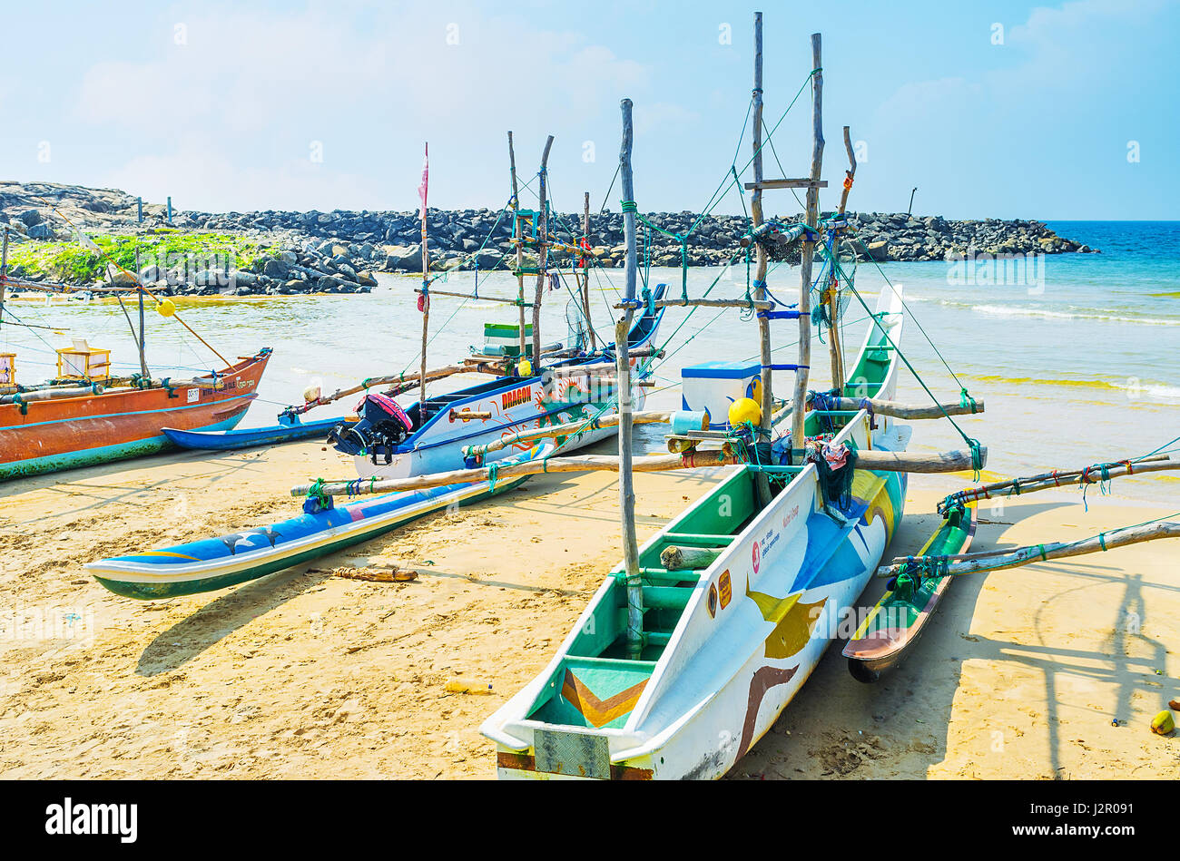 HIKKADUWA, SRI LANKA - DECEMBER 4, 2016: The oruwa boats on the ocean's ...