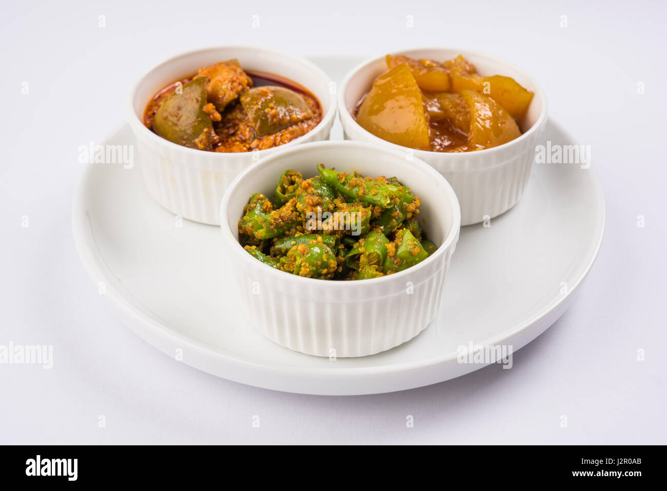 Group photograph of indian pickles like mango pickle , lemon pickle and ...