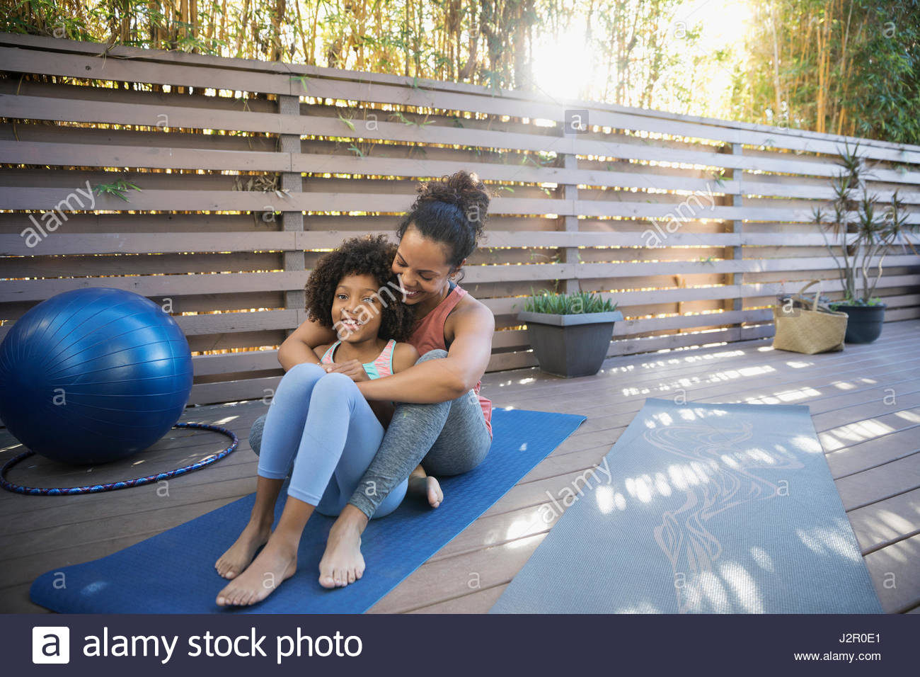 Woman hugging exercise ball hi-res stock photography and images - Alamy