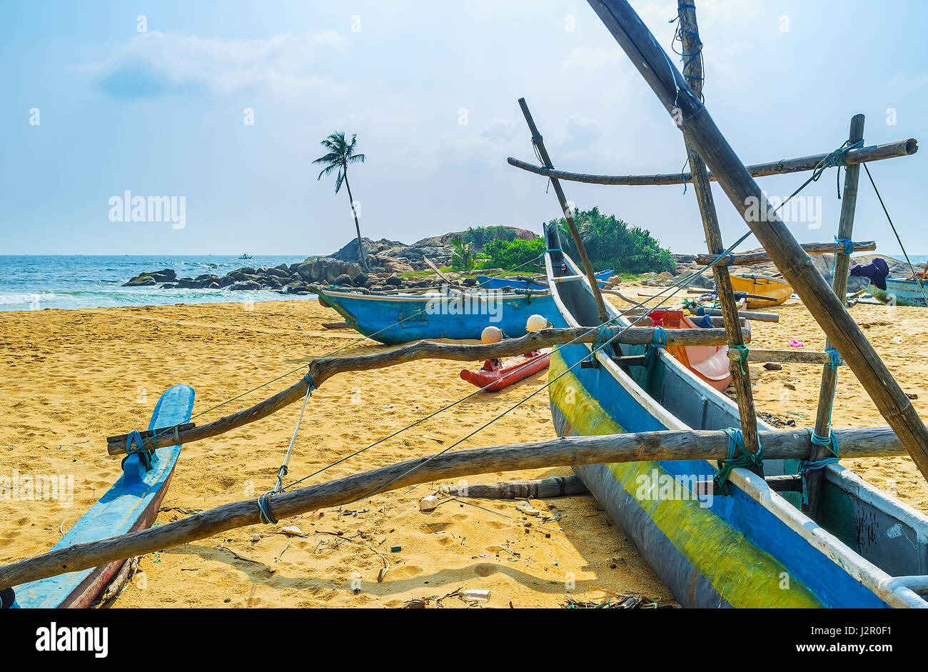 The Dodanduwa harbor through the masts and parts of oruwa canoe ...