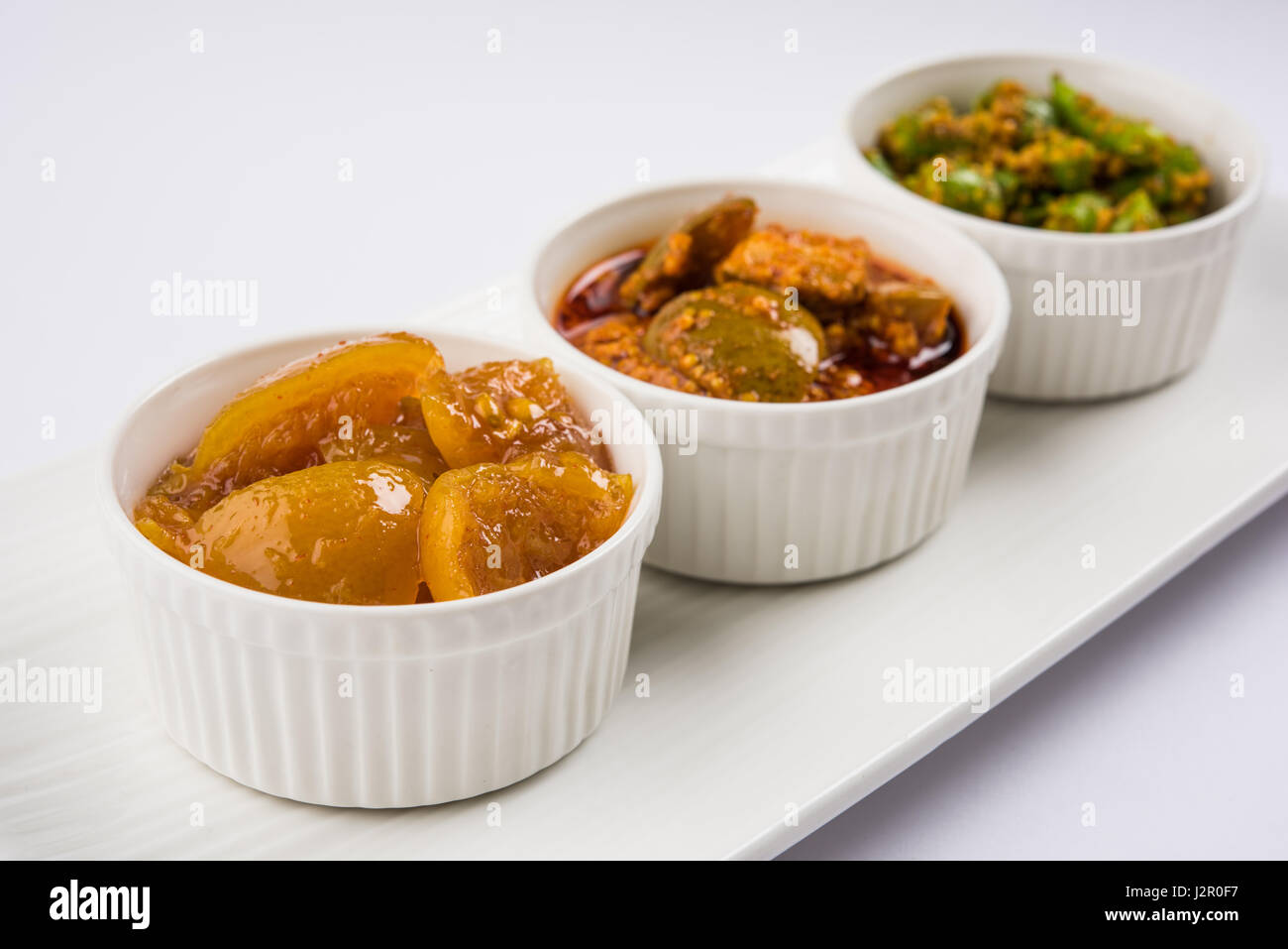 Group photograph of indian pickles like mango pickle , lemon pickle and ...