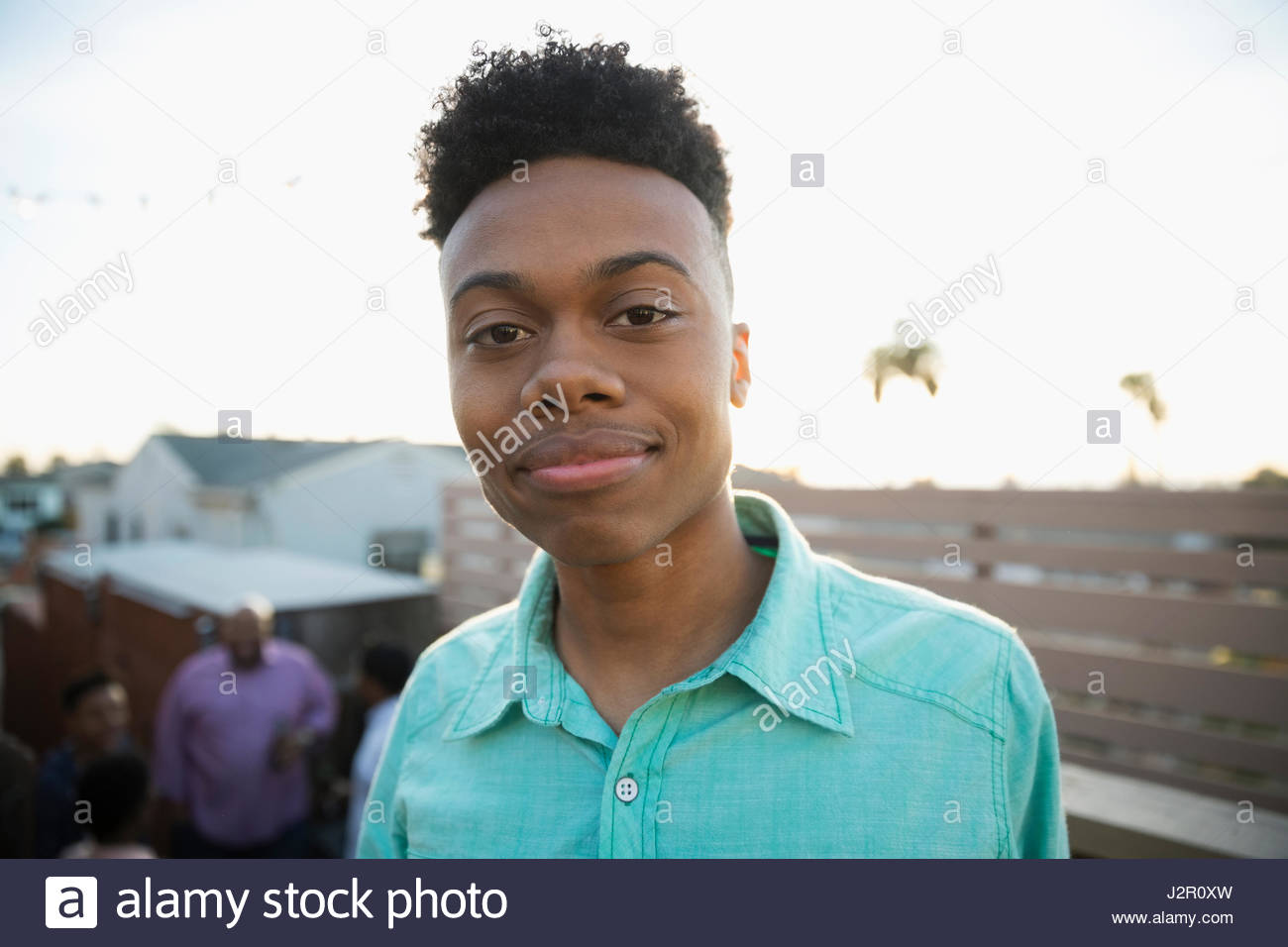 Portrait confident African American young man on summer deck Stock ...