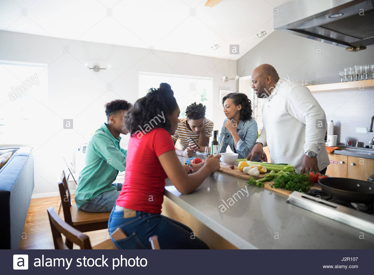 Black woman cooking in kitchen hi-res stock photography and images - Alamy