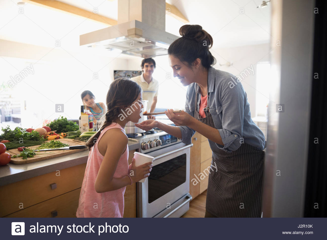 Real latino family kitchen cooking hi-res stock photography and images ...