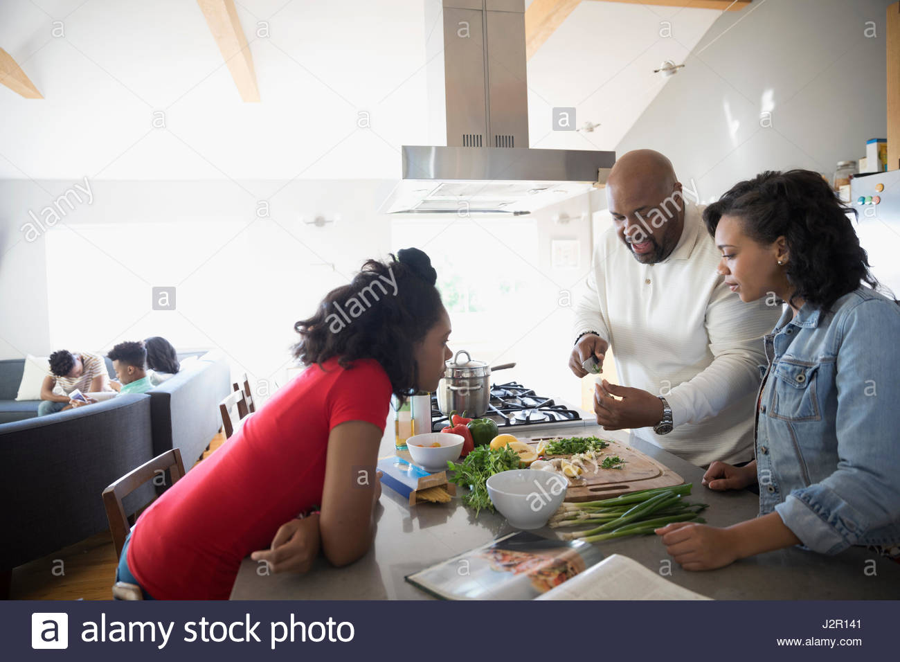 African American family cooking in kitchen Stock Photo - Alamy