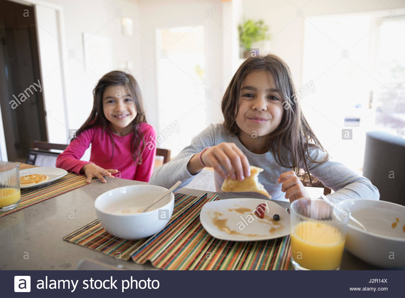 Asian girl eating breakfast hi-res stock photography and images - Alamy