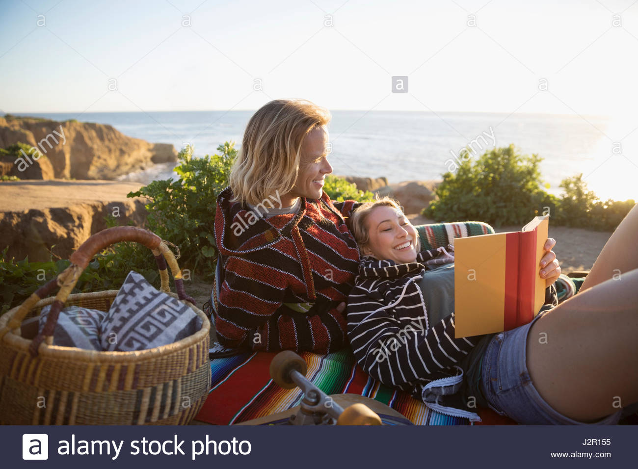 Two women reading beach hi-res stock photography and images - Alamy