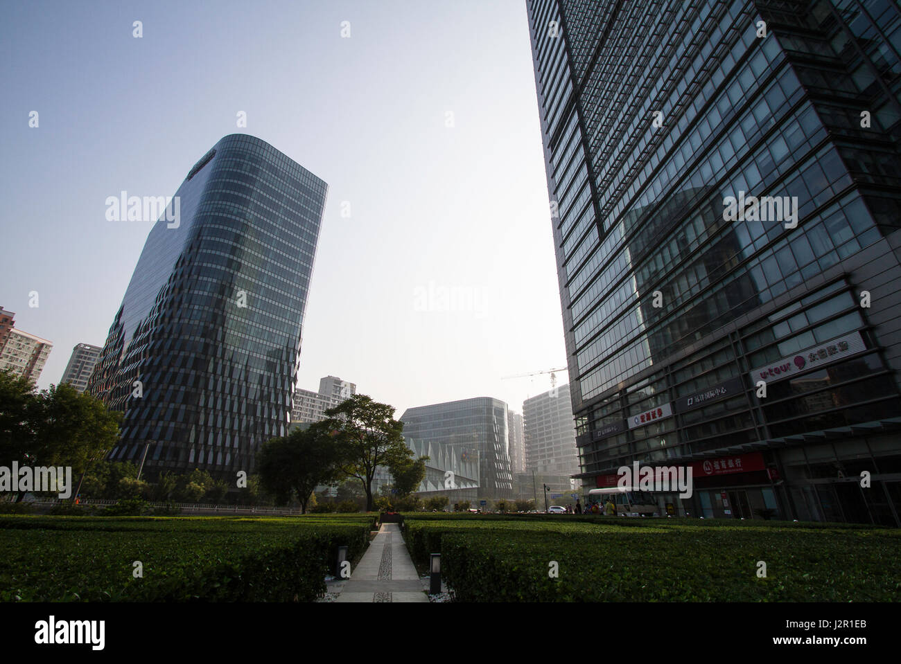 Office buildings tower over a plaza green space in Beijing's Chaoyang ...