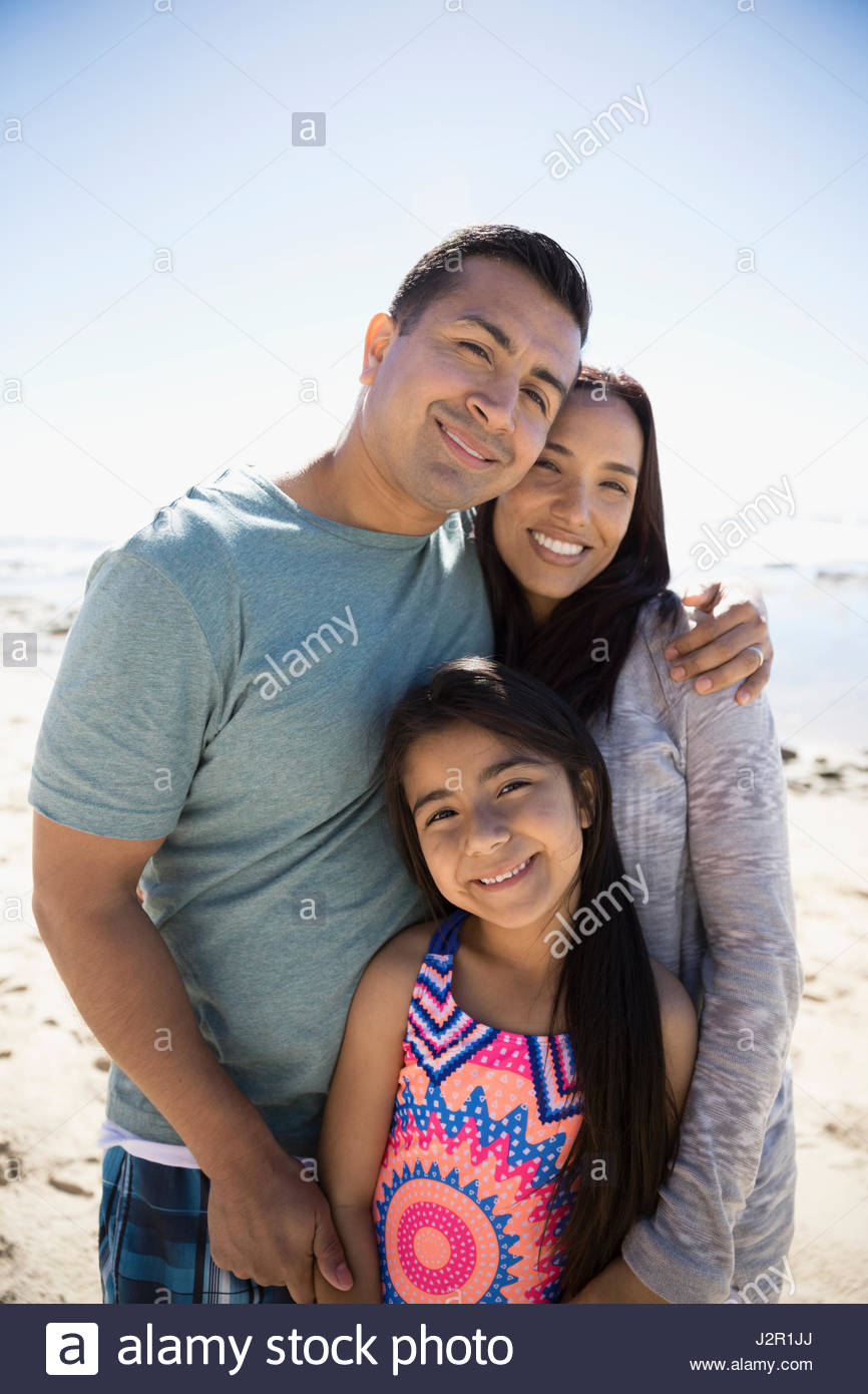 Smiling latin family hugging hi-res stock photography and images - Alamy