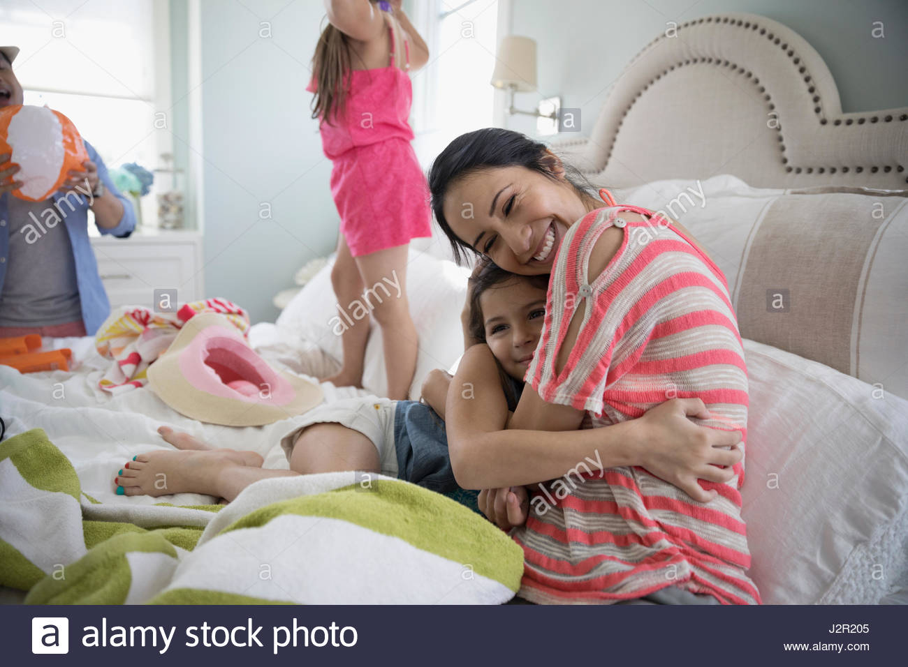 Daughter hugging her parents hi-res stock photography and images - Alamy