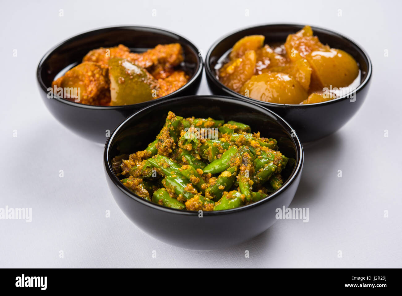 Group photograph of indian pickles like mango pickle , lemon pickle and ...