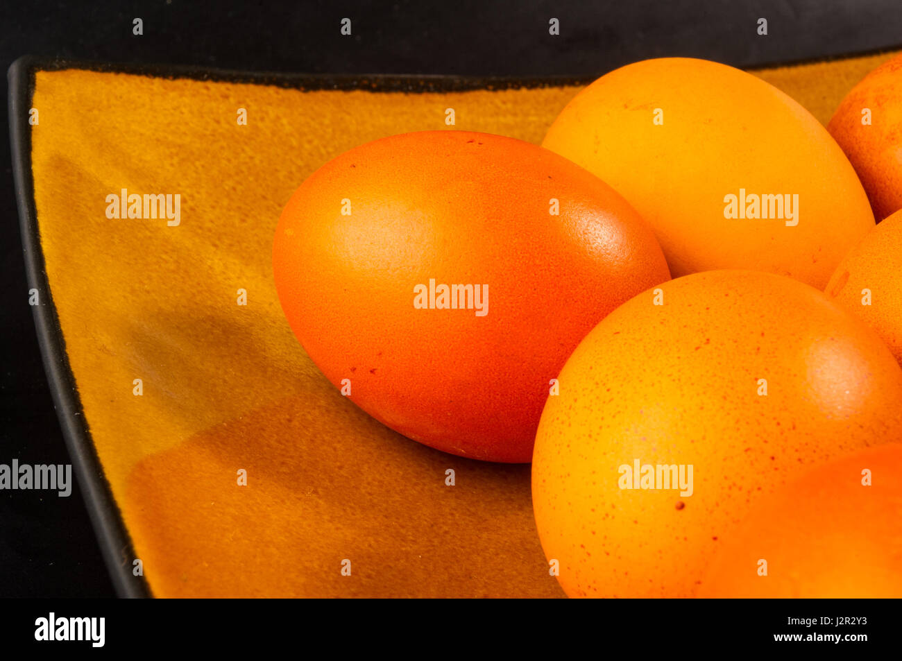 eggs colored with natural dye on brown dish Stock Photo - Alamy