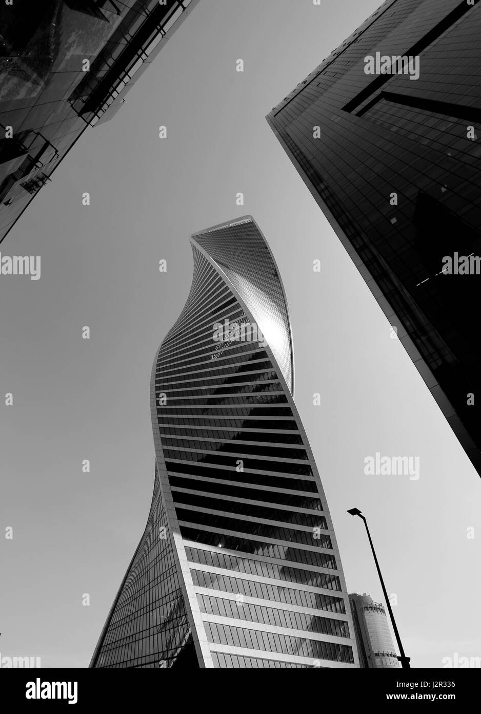Photo of modern towers of skyscrapers illuminated by the sun Stock ...