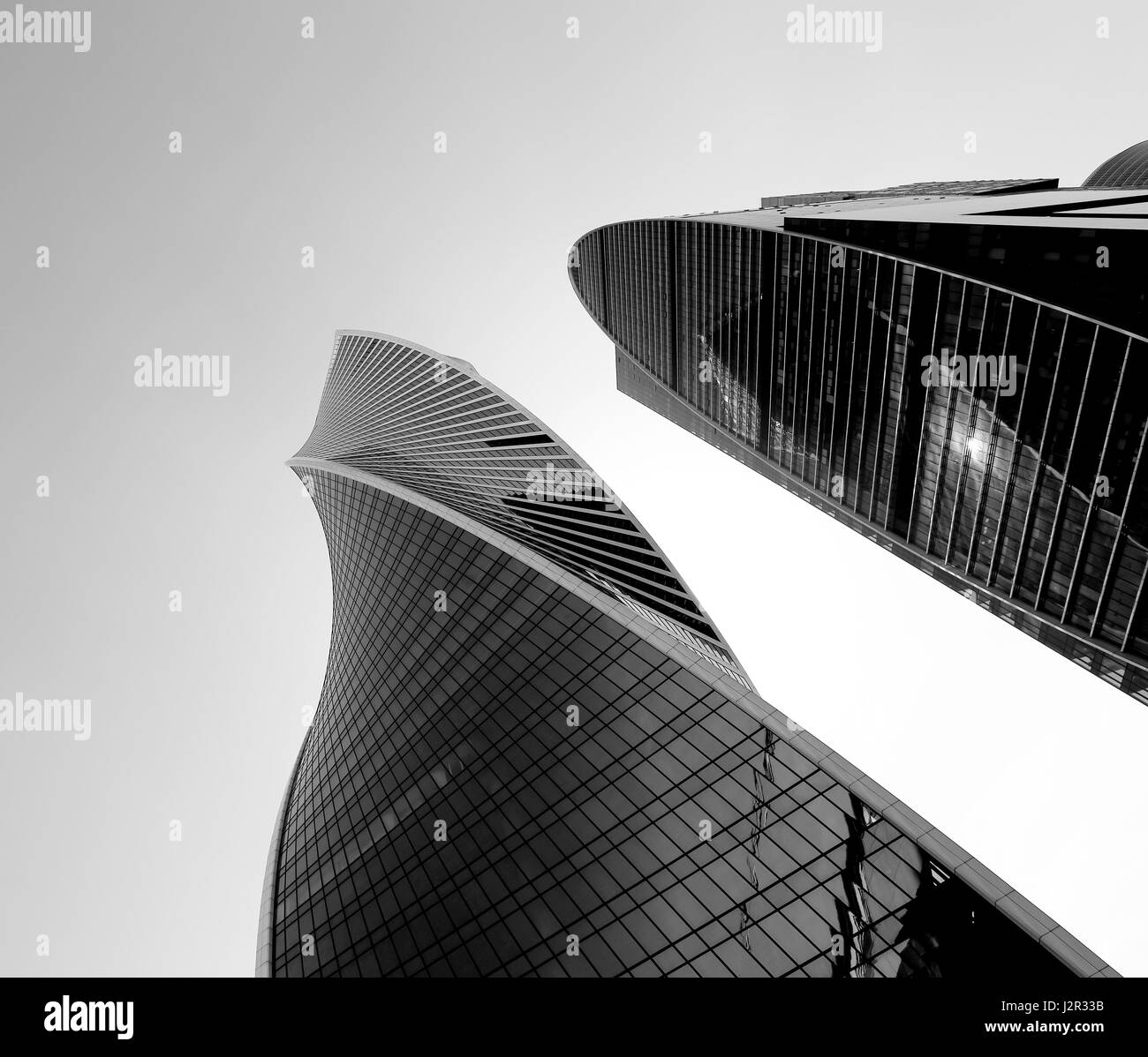 Photo of modern towers of skyscrapers illuminated by the sun Stock ...