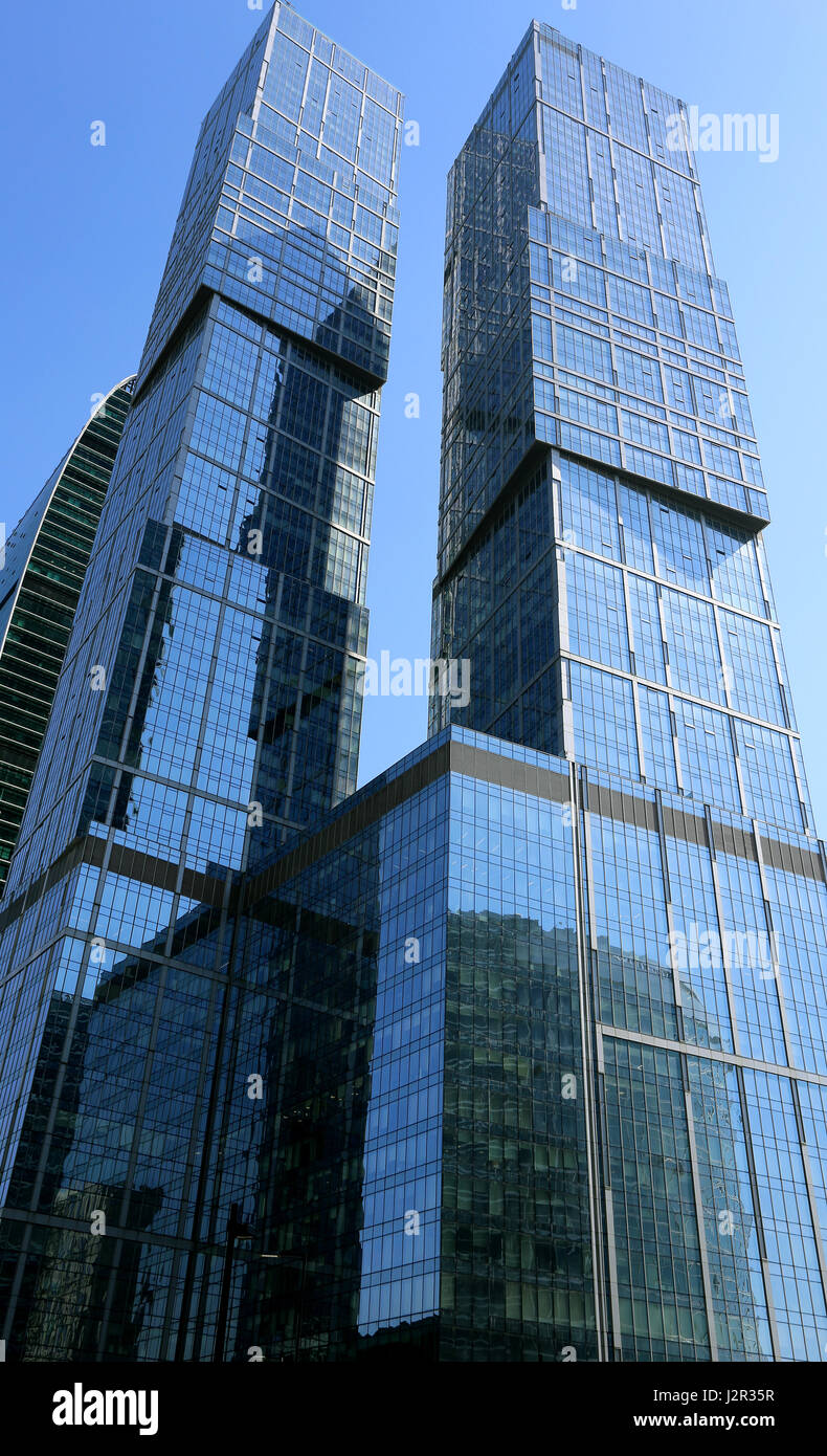 Photo of modern towers of skyscrapers illuminated by the sun Stock ...