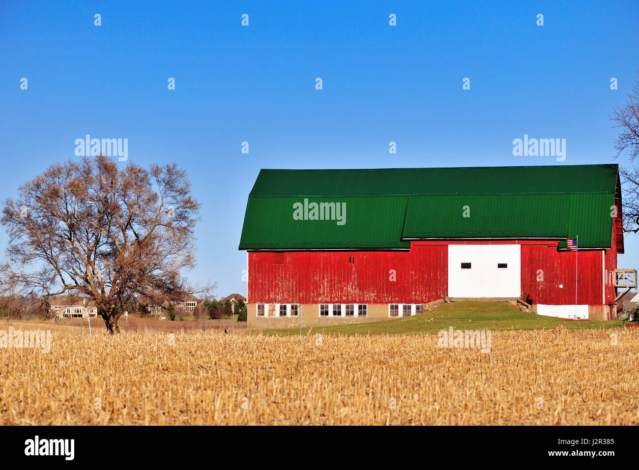Colorful barn sits by an empty field as the pair await spring and the ...