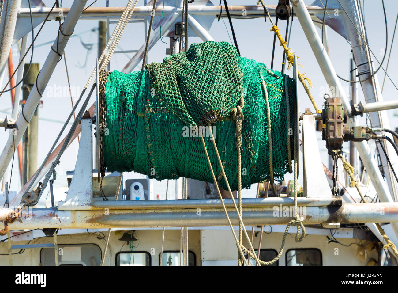 Fishing nets in a spool atop a commercial fishing boat in New Jersey ...