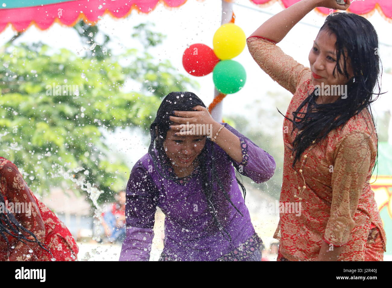Ethnic Marma girls participate on water festival on occasion of Baisabi ...