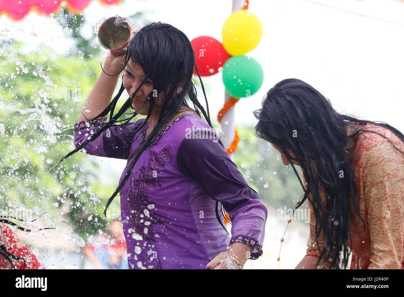 Ethnic Marma girls participate on water festival on occasion of Baisabi ...